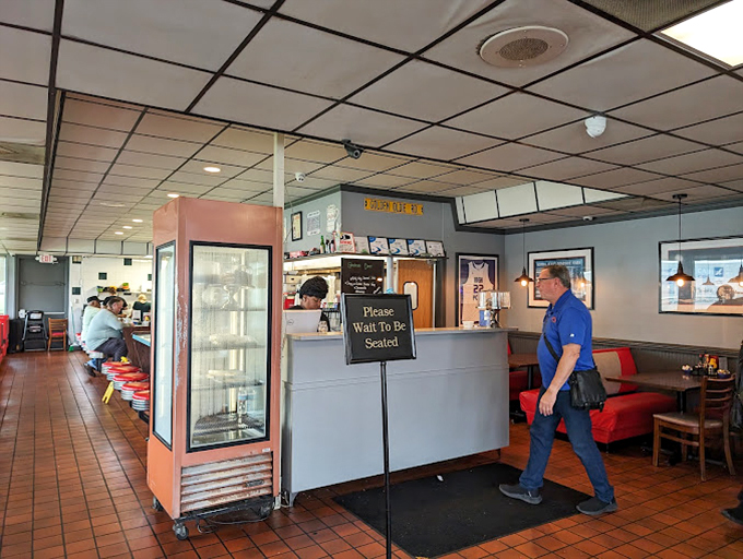 The staff moves with the practiced choreography of people who've turned feeding hungry humans into an art form that defies gravity.