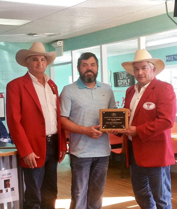 Community recognition on display—because when you make burgers this good, people with fancy plaques eventually take notice.