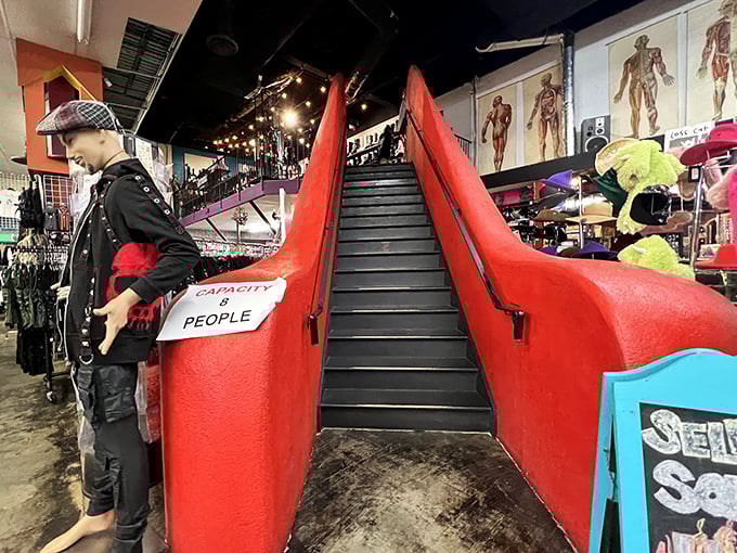 The stairway to retail heaven is flanked by giant red&hellip; something. In any other store, this would be weird. Here, it's practically understated.