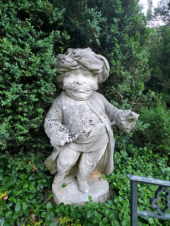 Garden statuary with personality to spare&mdash;this little fellow has been charming visitors for decades with his jaunty hat and stance.