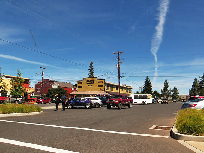 Blue skies frame Sisters' colorful downtown buildings, creating that rare place where parking your car feels like the start of an adventure, not a chore.