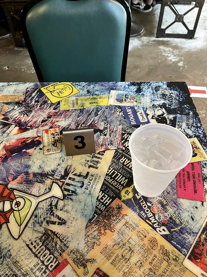 Table collages that make you wonder if your drink is sitting on actual concert tickets or artistic recreations.