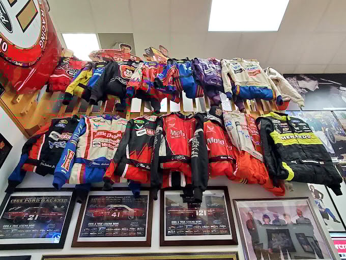 A rainbow of racing suits traces the evolution of NASCAR sponsorship&mdash;from simple designs to the logo-laden uniforms that turned drivers into billboards.