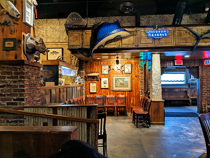 A marlin on the wall, weathered wood everywhere, and just enough neon to remind you—this isn't your average seafood joint; it's a full-blown experience.