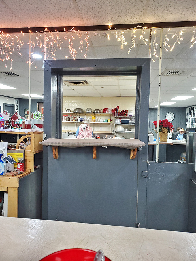 The pass-through window to the kitchen&mdash;where breakfast magic happens behind the scenes. Those twinkling lights add a touch of year-round cheer.