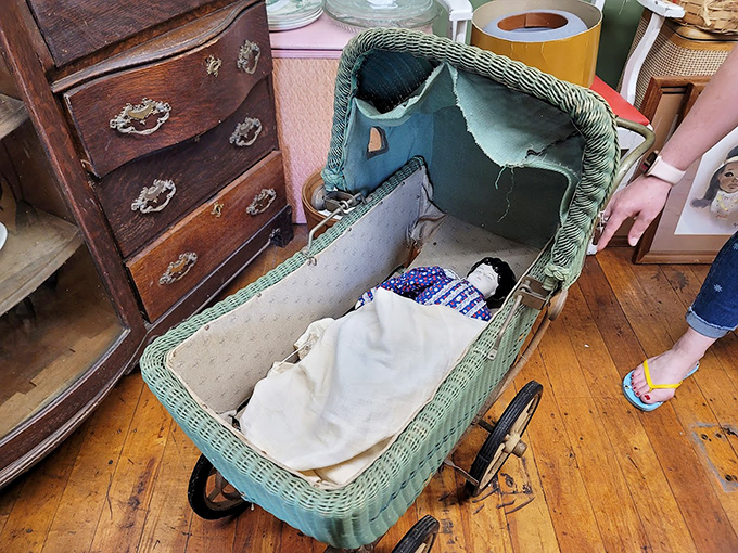 A wicker baby carriage that cradled dreams from another era, when dolls had porcelain faces and childhood moved at a gentler pace.