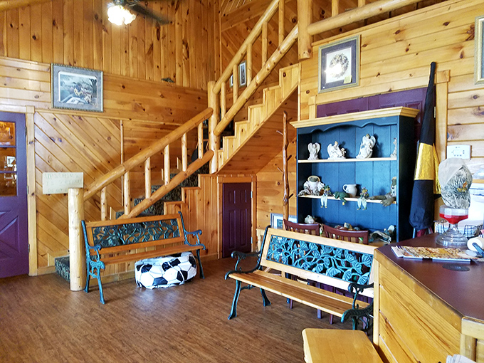 The waiting area with rustic benches and wooden staircase feels like your favorite cabin getaway&mdash;a preview of the comfort to come.