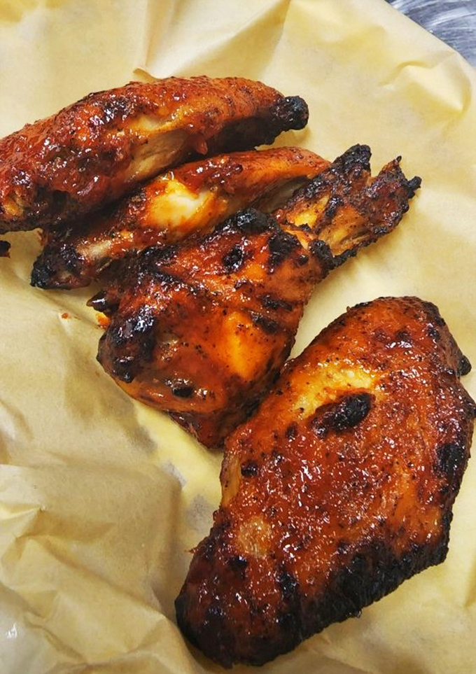 Wing-a-ding-ding! These saucy beauties look so finger-lickin' good, you'll be tempted to order a second round before finishing the first.
