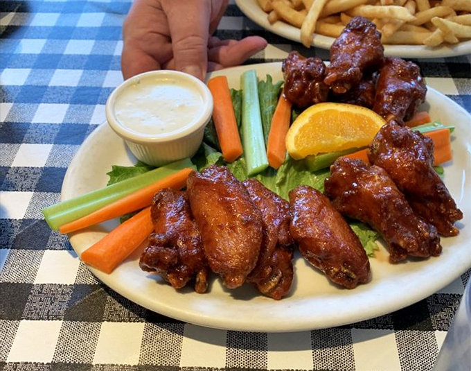 The bustling interior where strangers become temporary breakfast companions, united by the universal language of "pass the hot sauce."