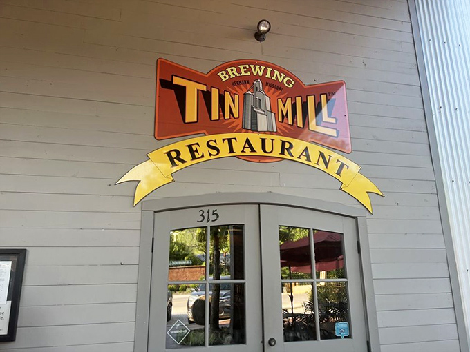 The entrance sign welcomes you like an old friend, promising the trifecta of happiness: brewing, good food, and a story to tell afterward.