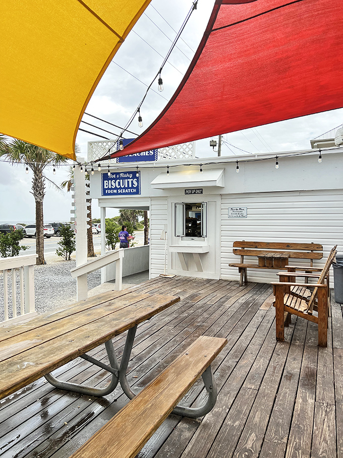 Colorful awnings and weathered wood create the perfect backdrop for vacation memories. Some tables have witnessed more joy than wedding venues.