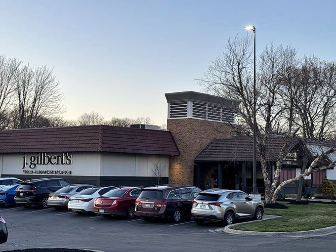 As evening approaches, J. Gilbert's stands ready for another night of culinary magic. Those cars in the lot belong to people making excellent decisions.