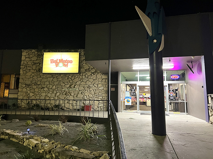 As evening falls, the Bel Mateo Bowl sign becomes a beacon for those seeking the simple joy of knocking things down with friends.