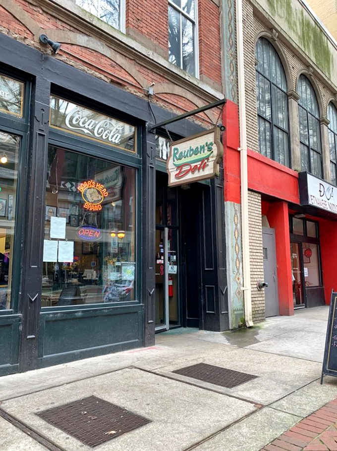 That neon "OPEN" sign might as well say "OPPORTUNITY." Reuben's Deli's storefront promises sandwich salvation to downtown Atlanta wanderers.