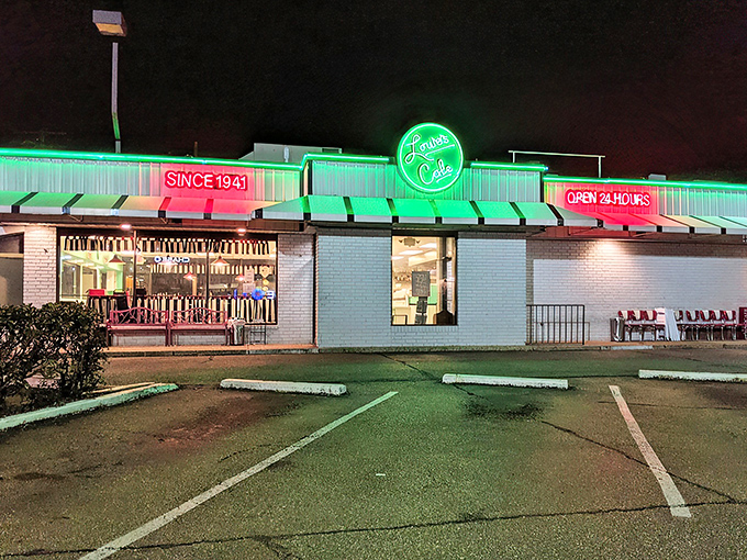 By night, Louie's neon glow becomes a lighthouse for the hungry, announcing "OPEN 24 HOURS" like a beautiful promise.