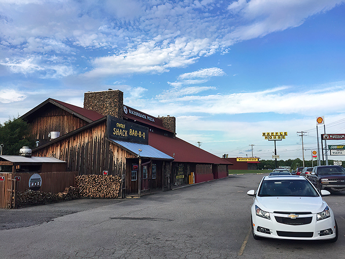 From the outside, it's just another roadside spot. But those stacks of firewood hint at the serious smoking business happening within.