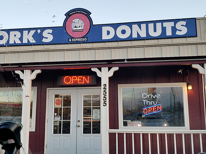 As dusk settles, the neon "OPEN" sign glows like a lighthouse, guiding hungry travelers to safe harbor in a sea of mediocre breakfast options.