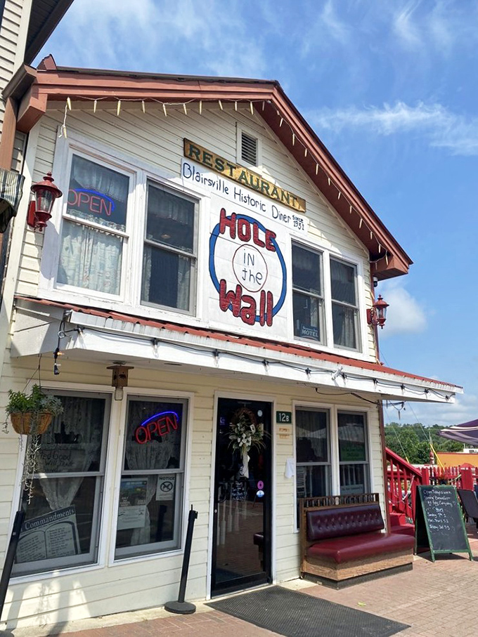 Blue skies and red trim frame this breakfast haven, standing ready to welcome hungry travelers and locals alike.