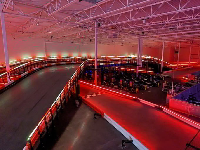 The expansive interior bathed in dramatic red lighting makes every lap feel like you're racing through the final scene of an action movie.