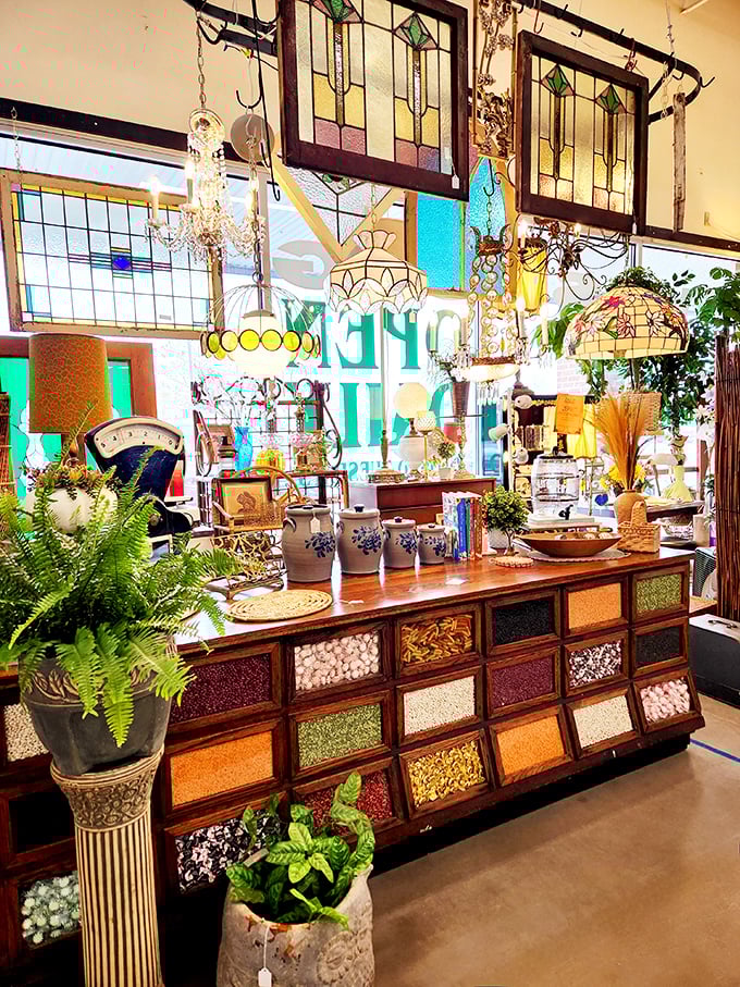 Not just stained glass&mdash;it's illuminated history hanging from the ceiling. That seed cabinet below once organized a farmer's entire future.