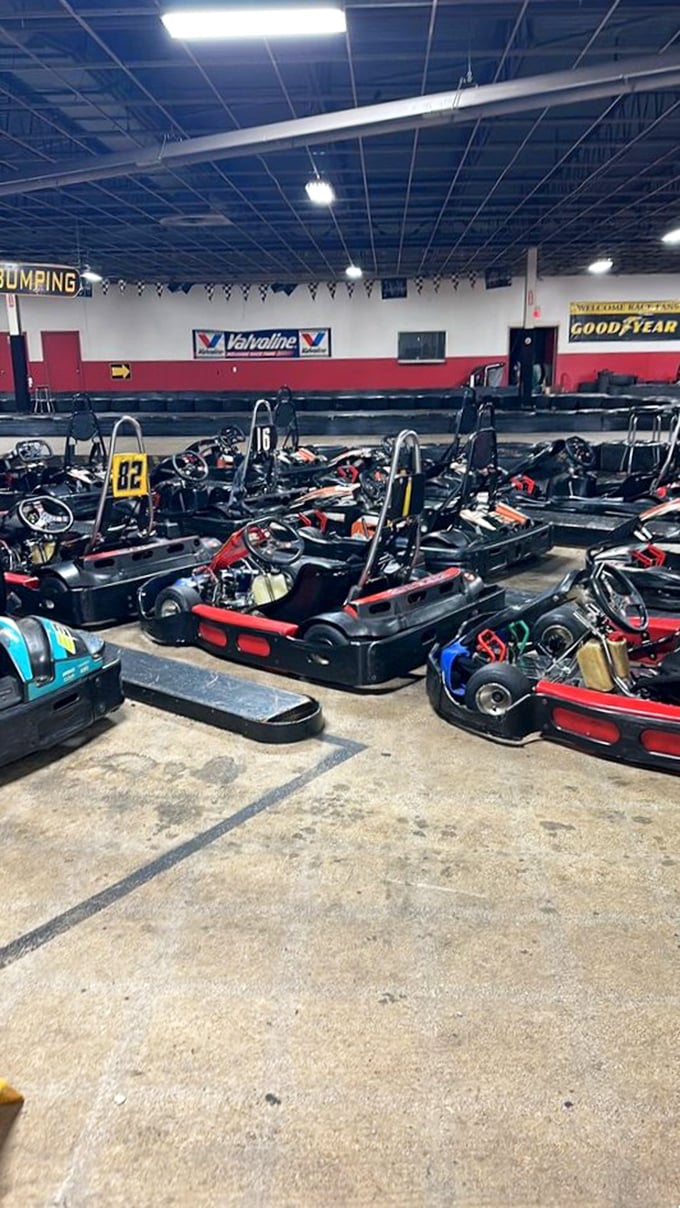 The sleeping beasts await their drivers, each kart promising the same thing—three minutes where spreadsheets and to-do lists cease to exist.