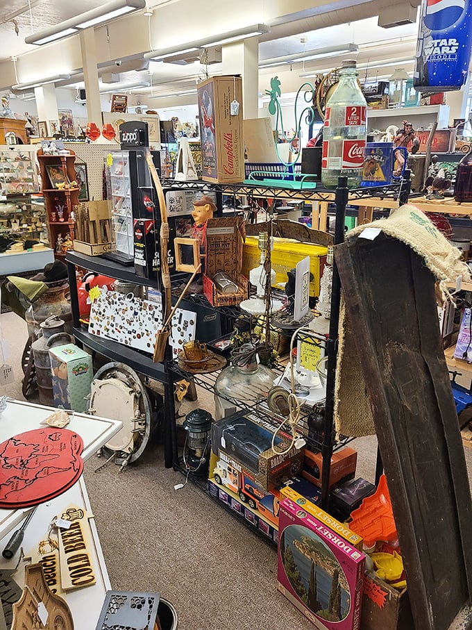 Coca-Cola memorabilia shares space with vintage toys and puzzles. Every shelf is a nostalgic trip to childhood for someone.