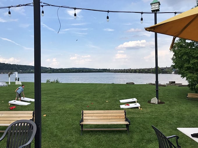 A grassy riverside oasis with cornhole boards&mdash;because nothing pairs better with oysters than a friendly game of toss.