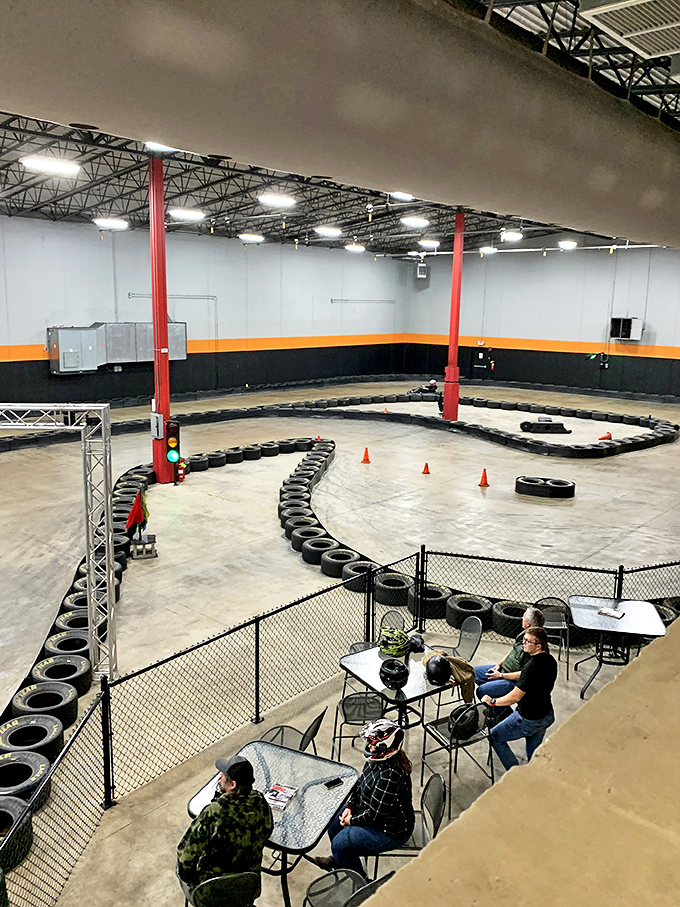 Race strategists in their natural habitat. From this vantage point, every driver looks simultaneously heroic and hilariously serious about go-karting.