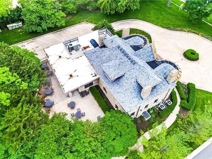 From above, the castle's impressive footprint reveals how this limestone marvel stands proudly amid the green Kansas landscape, a European island in an American sea.