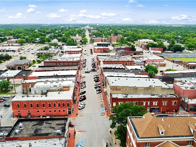 Guthrie's grid of streets reveals itself from above, a masterplan of American optimism laid out in brick, mortar, and undeniable charm.