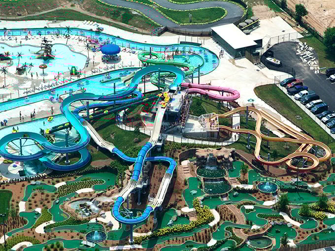 The full glory of Jungle Jim's revealed from above &ndash; a masterpiece of water recreation featuring slides, pools, and miniature golf for complete family fun.
