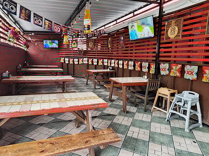 The al fresco dining area's rustic charm offers a casual vibe for enjoying your Mexican feast. Those wooden benches have witnessed countless happy food moments.
