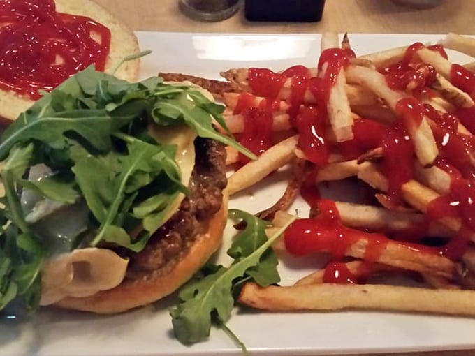 This burger topped with arugula isn't just farm-to-table; it's a delicious reminder that sometimes vegetables and beef can coexist peacefully.