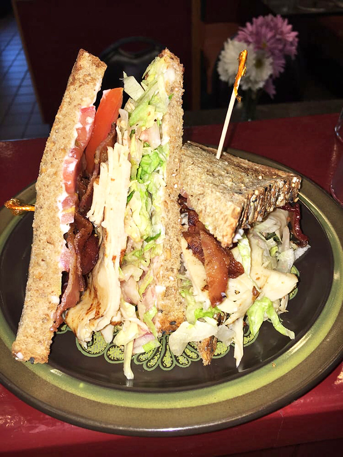 Layer upon magnificent layer – this club sandwich stands tall like a delicious skyscraper of flavor.