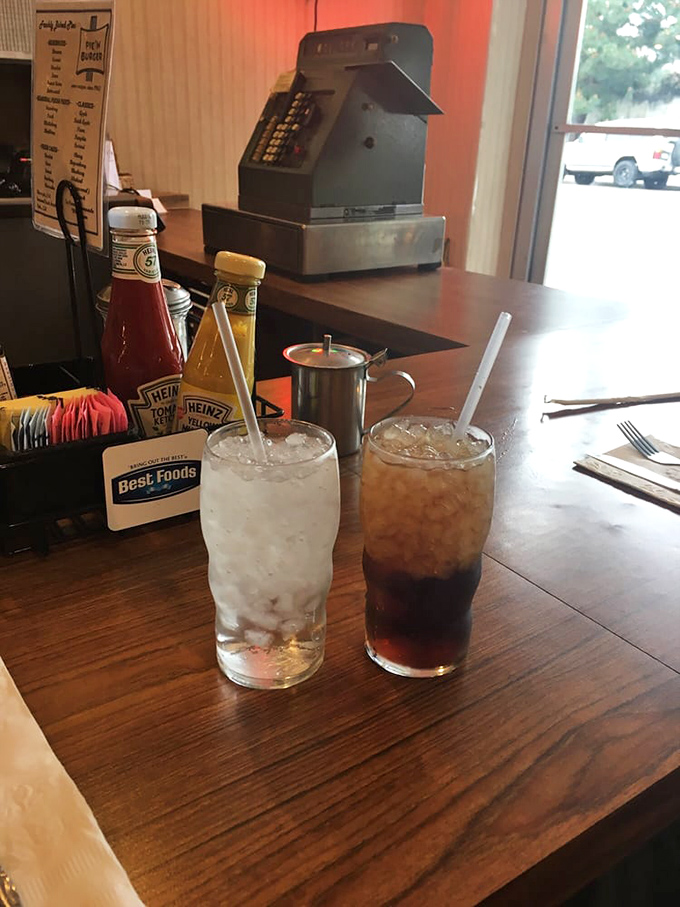 Classic sodas in glasses that weigh something substantial. No paper straws here—just pure, unadulterated refreshment like grandpa remembers.