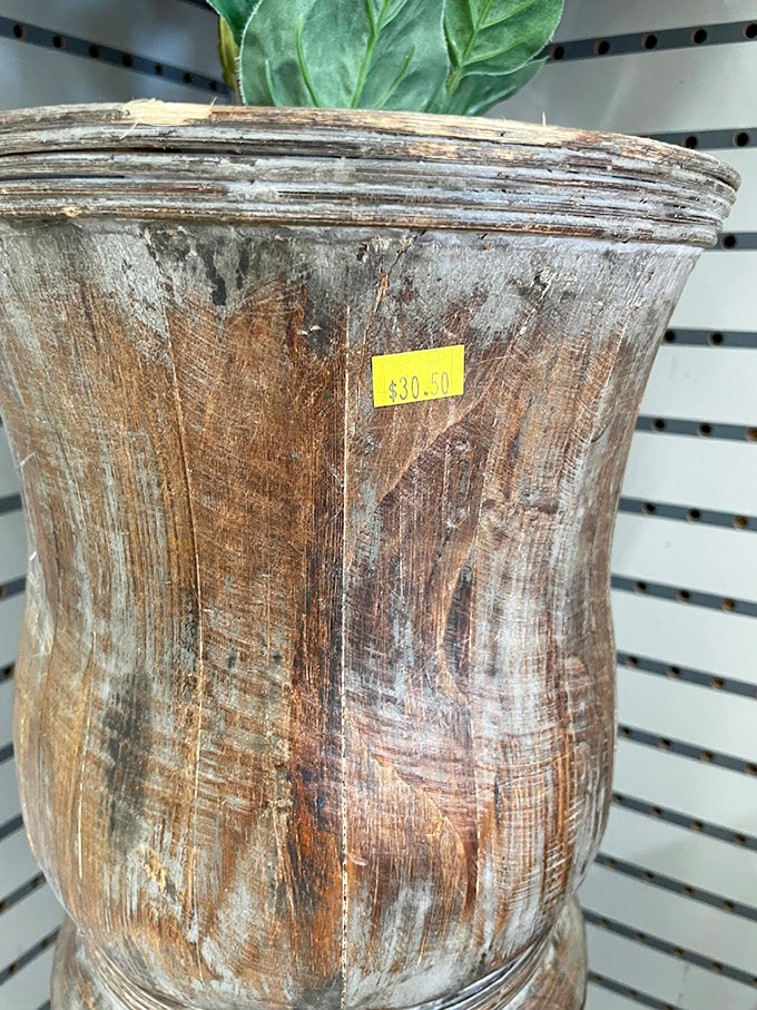 This weathered wooden vase has lived many lives before arriving here. For thirty dollars, you're not just buying decor&mdash;you're adopting a piece of history.