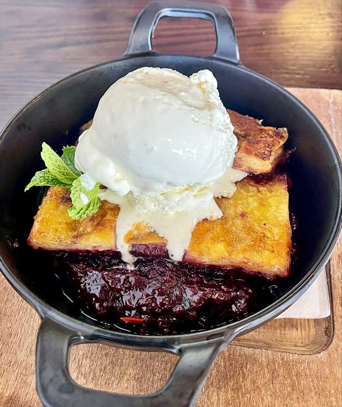 The blackberry cobbler with ice cream performs the impossible magic trick of somehow finding room in your stomach even after you've sworn you couldn't eat another bite.