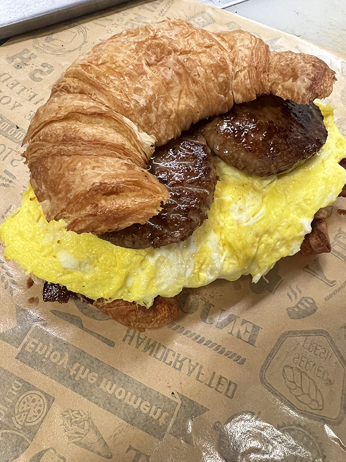 The breakfast sandwich that answers the eternal question: "Why choose between a croissant and sausage and egg?" with a resounding "You shouldn't have to."