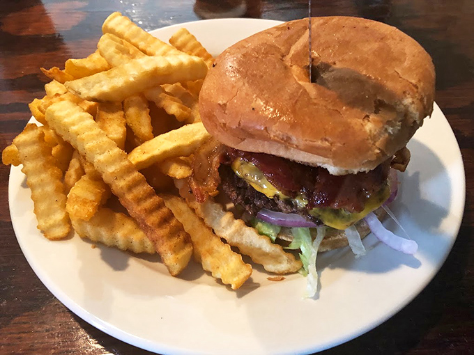 The burger arrives looking like it just stepped off a commercial set&mdash;the kind that makes neighboring tables ask, "What is THAT and how do I get one?"