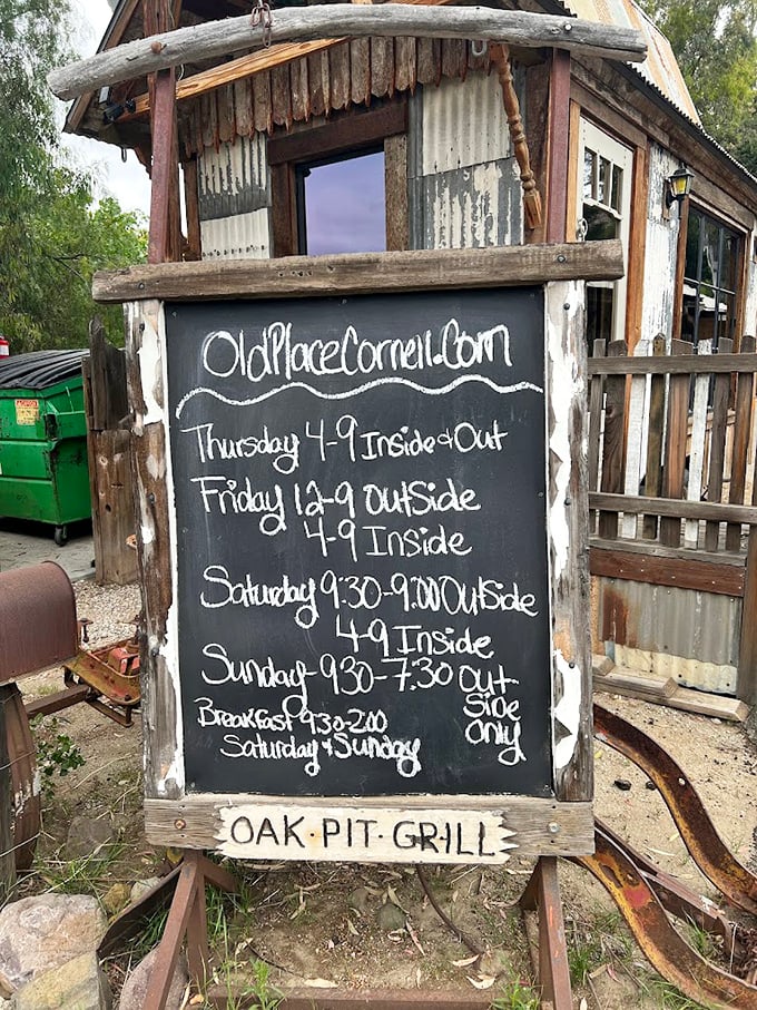 Hours scrawled on a chalkboard&mdash;because places with character don't need digital displays. "Oak Pit Grill" says everything you need to know.