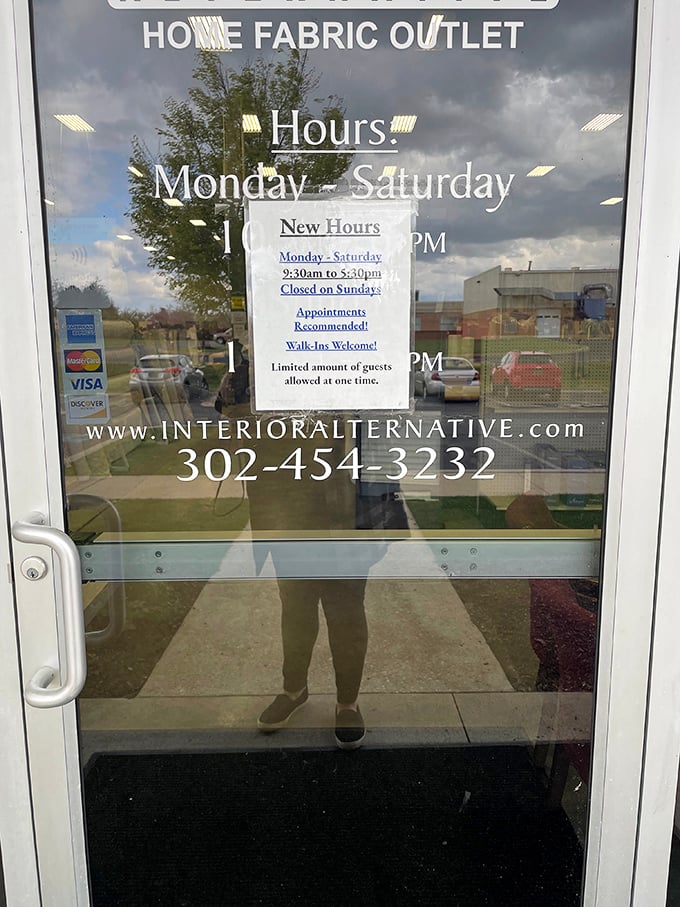 Business hours posted with a gentle warning &ndash; limited guests allowed inside. Even paradise has capacity limits in the modern world.