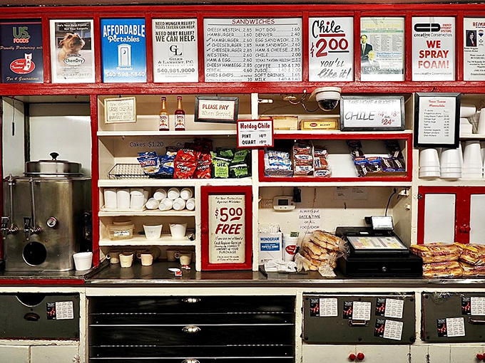 Behind the counter, where magic happens. The organized chaos of condiments, snacks, and supplies is a system perfected through nine decades of service.