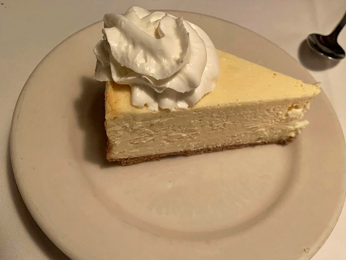 A slice of New York cheesecake that would make a native Manhattanite nod in approval. Dense, creamy, and topped with a cloud of whipped cream &ndash; dessert perfection doesn't need to be complicated.