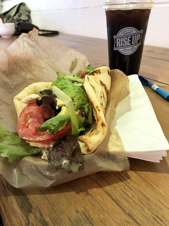 The perfect marriage of greens, warm pita, and fresh ingredients, proving that Rise Up's culinary talents extend well beyond breakfast.