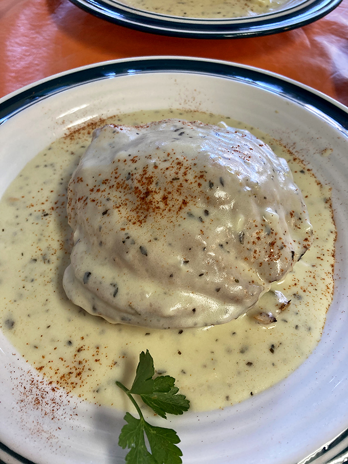 The dining area's golden walls and Eiffel Tower decor create that rare atmosphere where both first dates and family gatherings feel equally at home. 