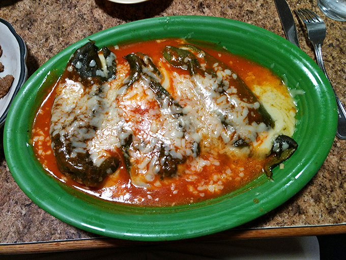 Chile rellenos should be the litmus test for any Mexican restaurant. This one, bathed in red sauce and melted cheese, passes brilliantly.