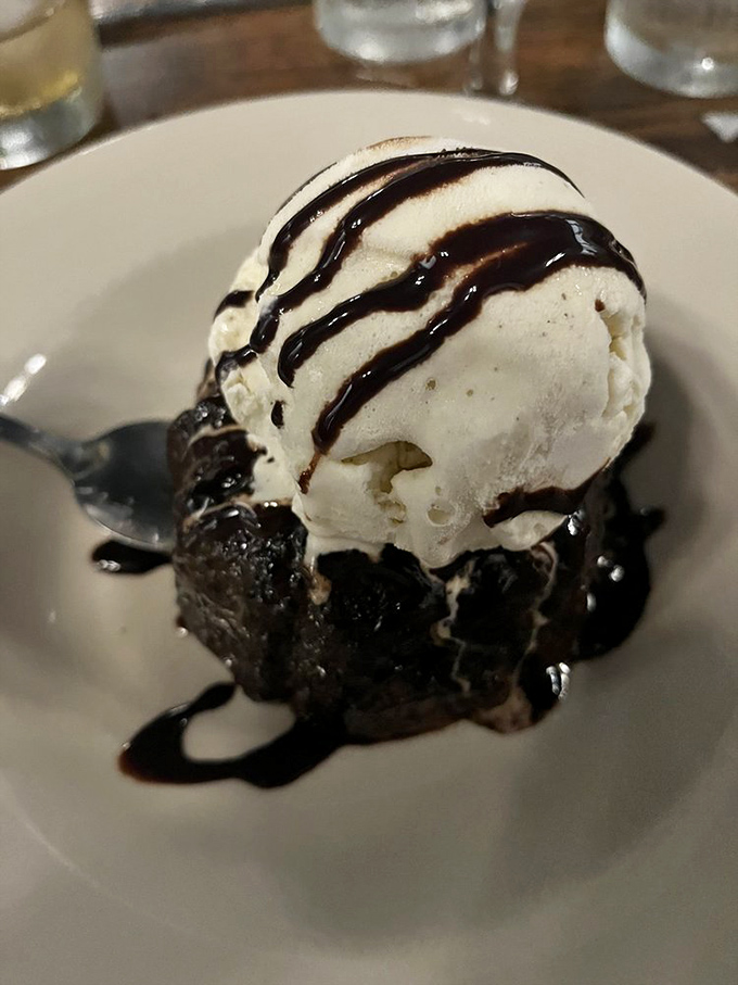 The chocolate lava cake's warm center flows like your willpower after a perfect steak dinner&mdash;resistance is deliciously futile.