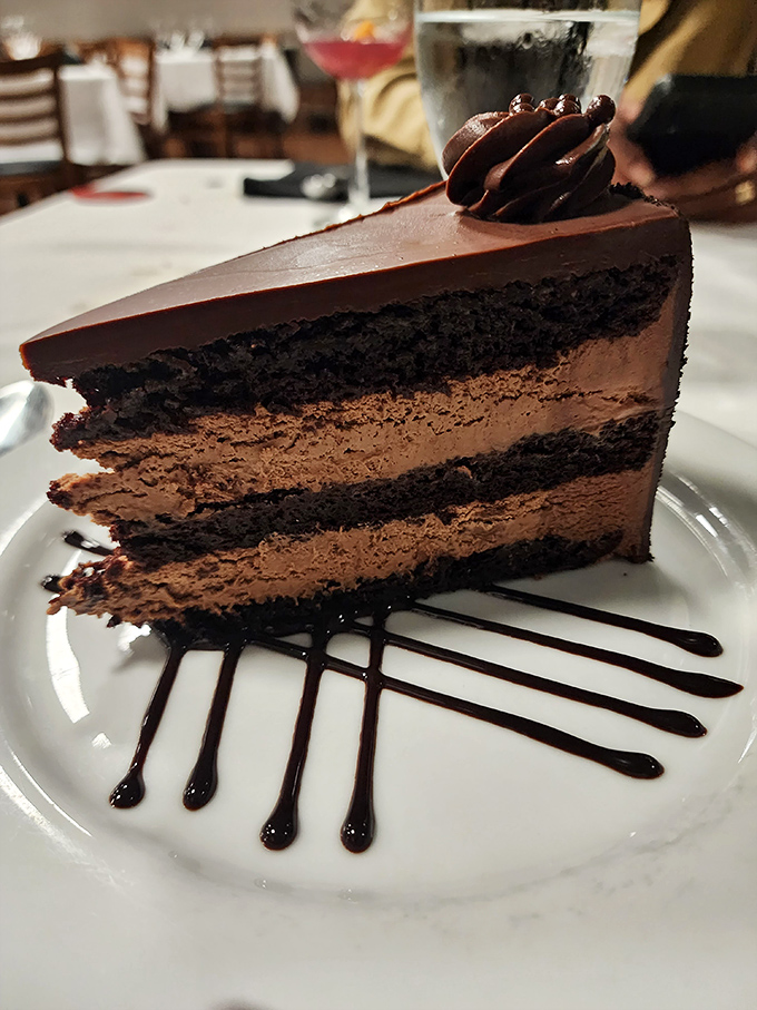 This chocolate cake doesn't just have layers—it has chapters, each one telling a richer story than the last. The chocolate drizzle is the perfect epilogue.