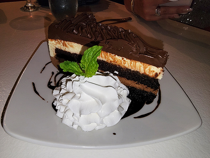 A chocolate cake so decadent it should require a permission slip. The mint garnish isn't fooling anyone&mdash;this is dessert with no apologies.