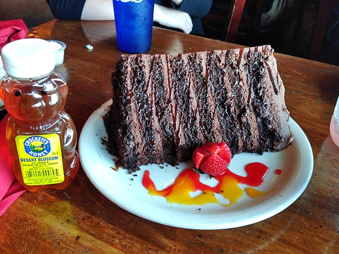 This chocolate cake isn't playing around. With layers taller than some Arizona cacti, it's the sweet finale that requires both a fork and strategy.